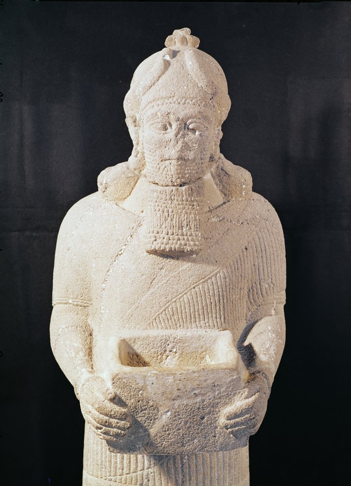 Statuette of a man carrying a box, from Arslan Tach, Syria (detail)