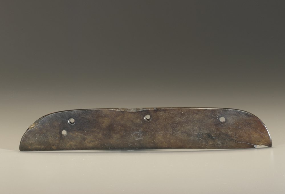 Ceremonial implement; comb-shaped blade form