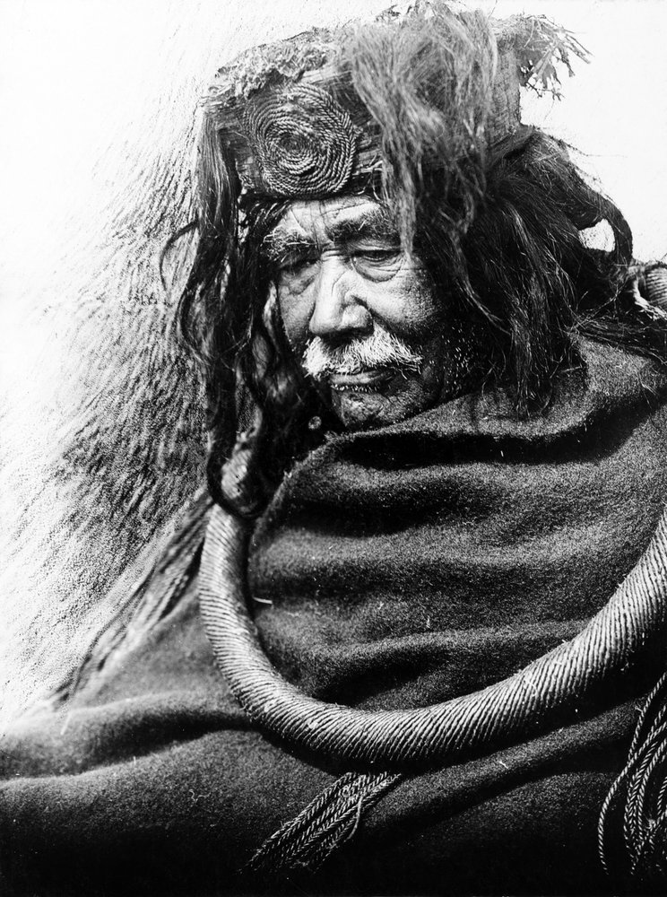 The Hamatsa, Nakoaktok c. 1910 Half-length portrait of Nakoaktok man, facing left, wearing cedar ...