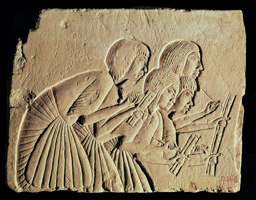 Tablet depicting four scribes at work, New Kingdom