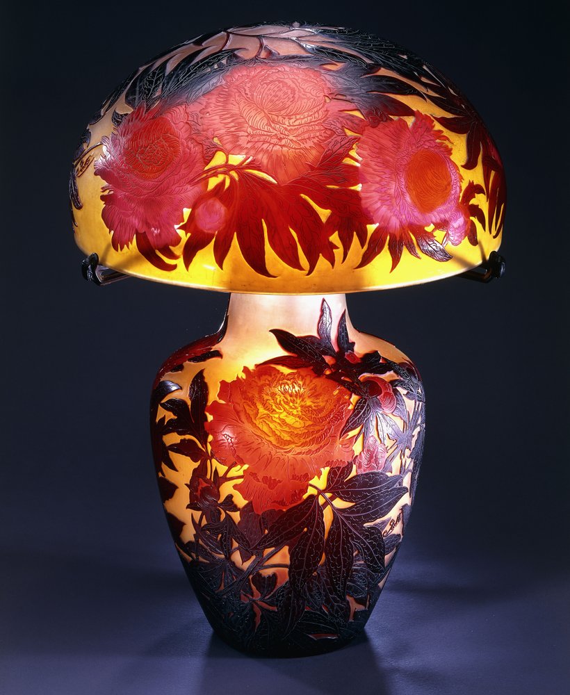 A double overlaid and etched glass table lamp by Emile Galle