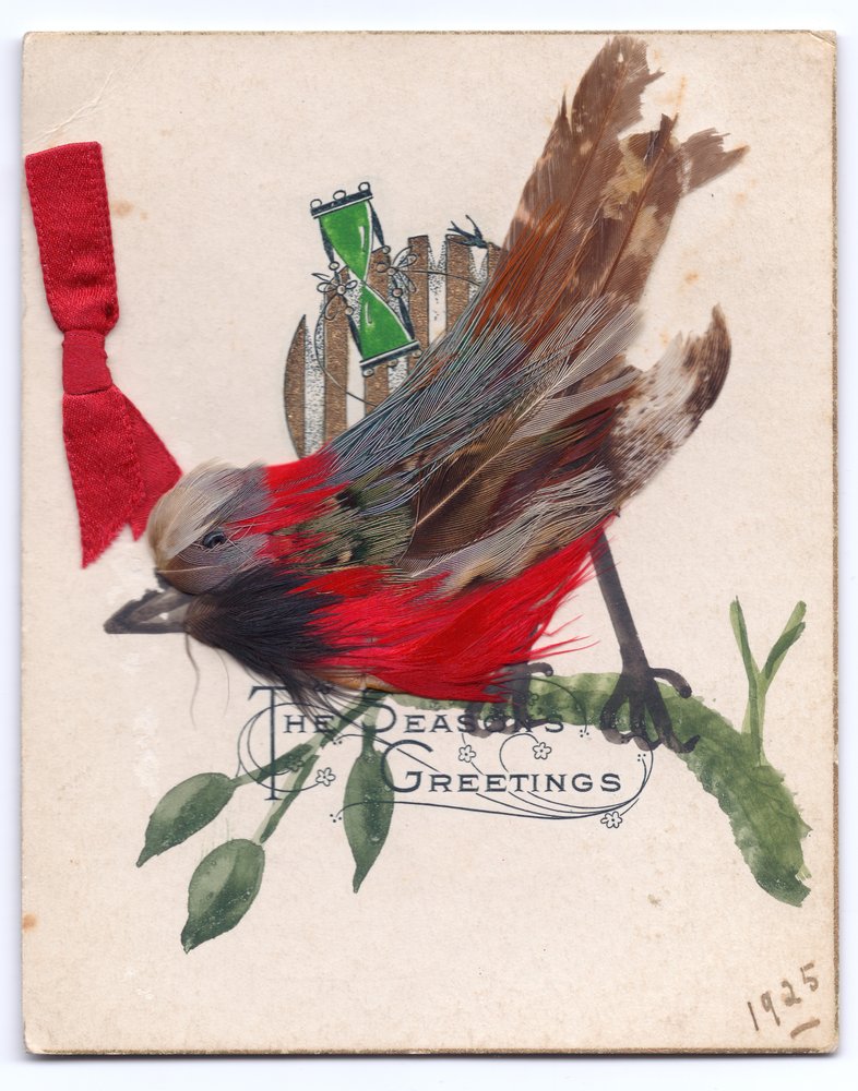 A Victorian Christmas card of a robin made out of feathers