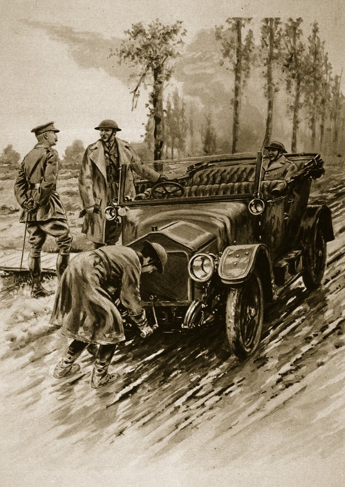 A chauffeur of the Women's Army Auxiliary Corps starting the engine of ...