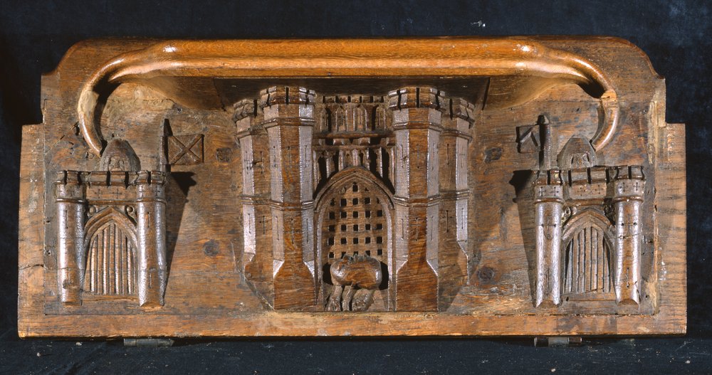 A misericord depicting Sir Yvain's horse trapped as the portcullis of ...