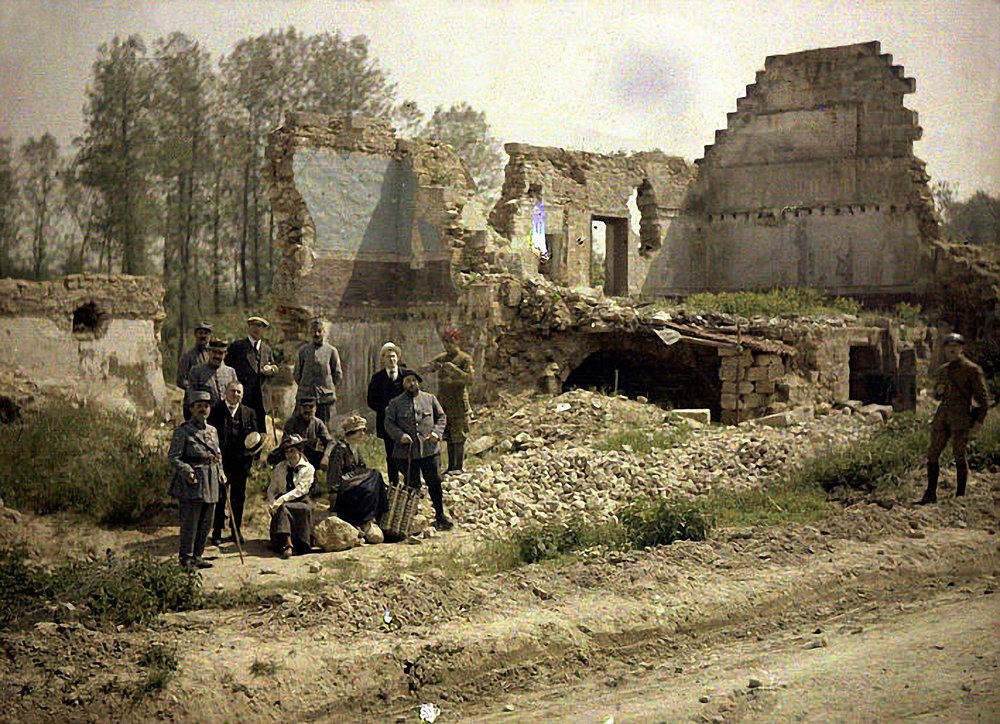French soldiers and actors of the front theatre pose in the ruins ...