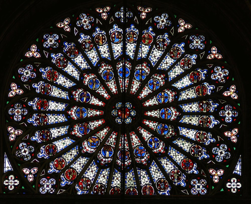Rose window depicting Christ surrounded by the twelve Apostles and ...