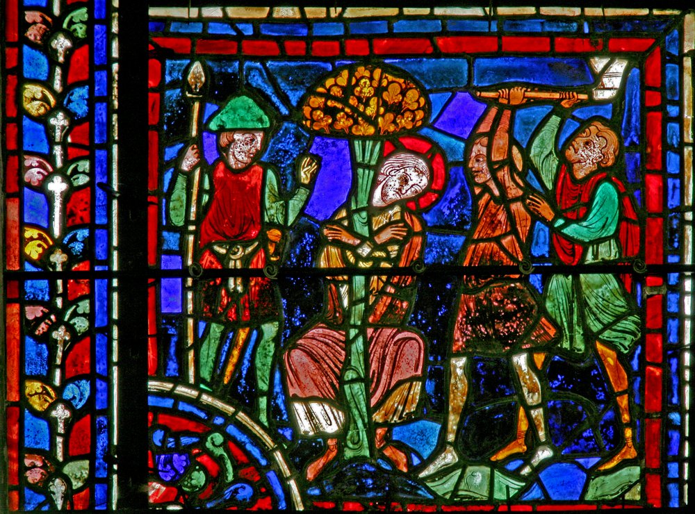 The St Martin window: the saint is tied to a tree by two brigands