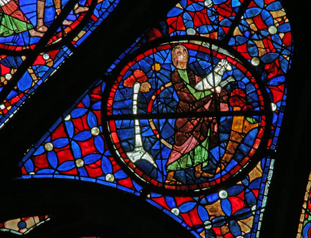 Window w115 depicting Abel brings a lamb to sacrifice