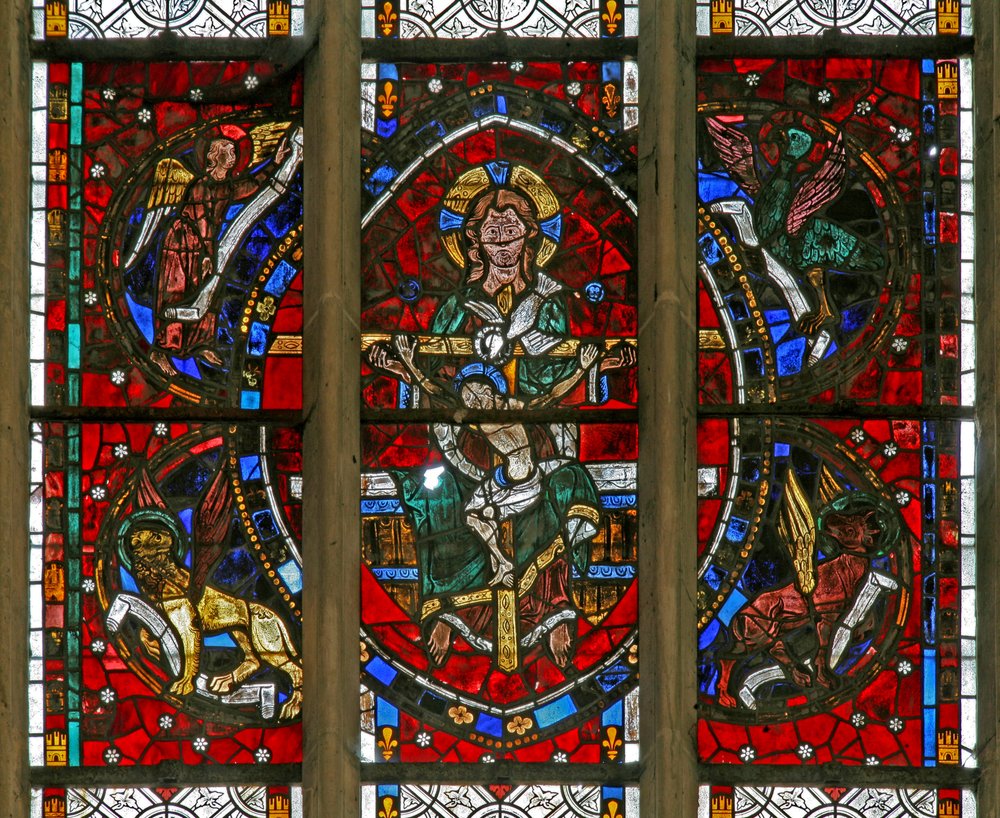 Window depicting the Trinity surrounded by the emblems of the Evangelists
