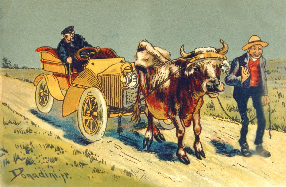 Cow pulling a motor car - a breakdown in the early days of motoring
