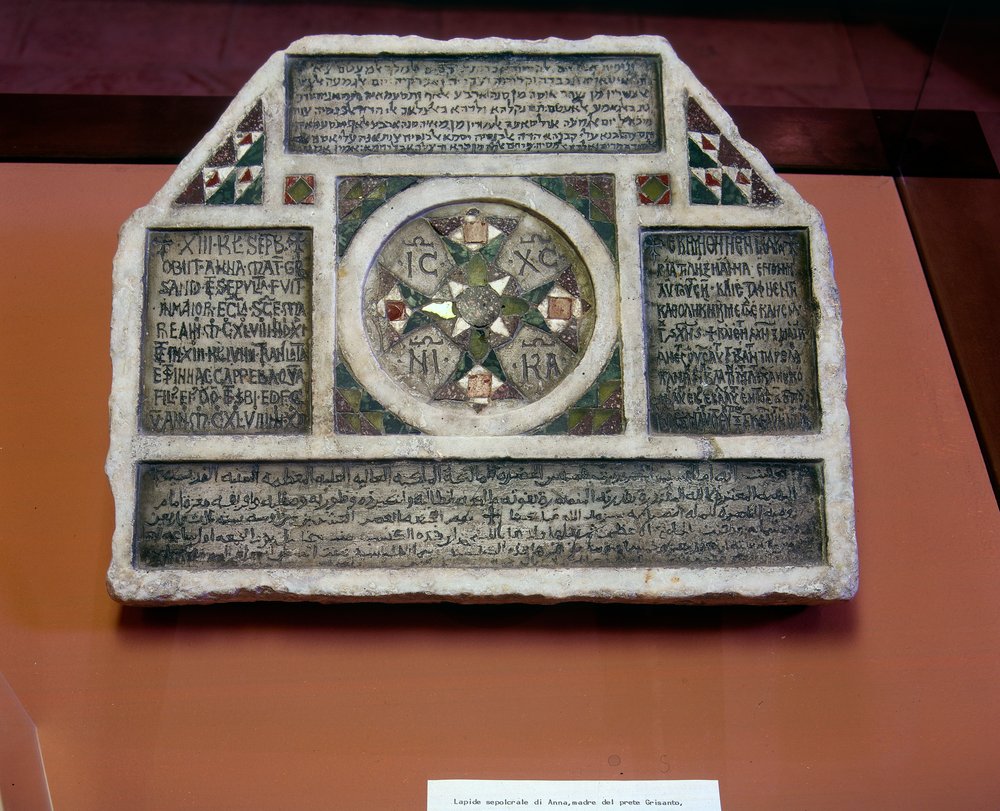 Tombstone with inscriptions in four languages