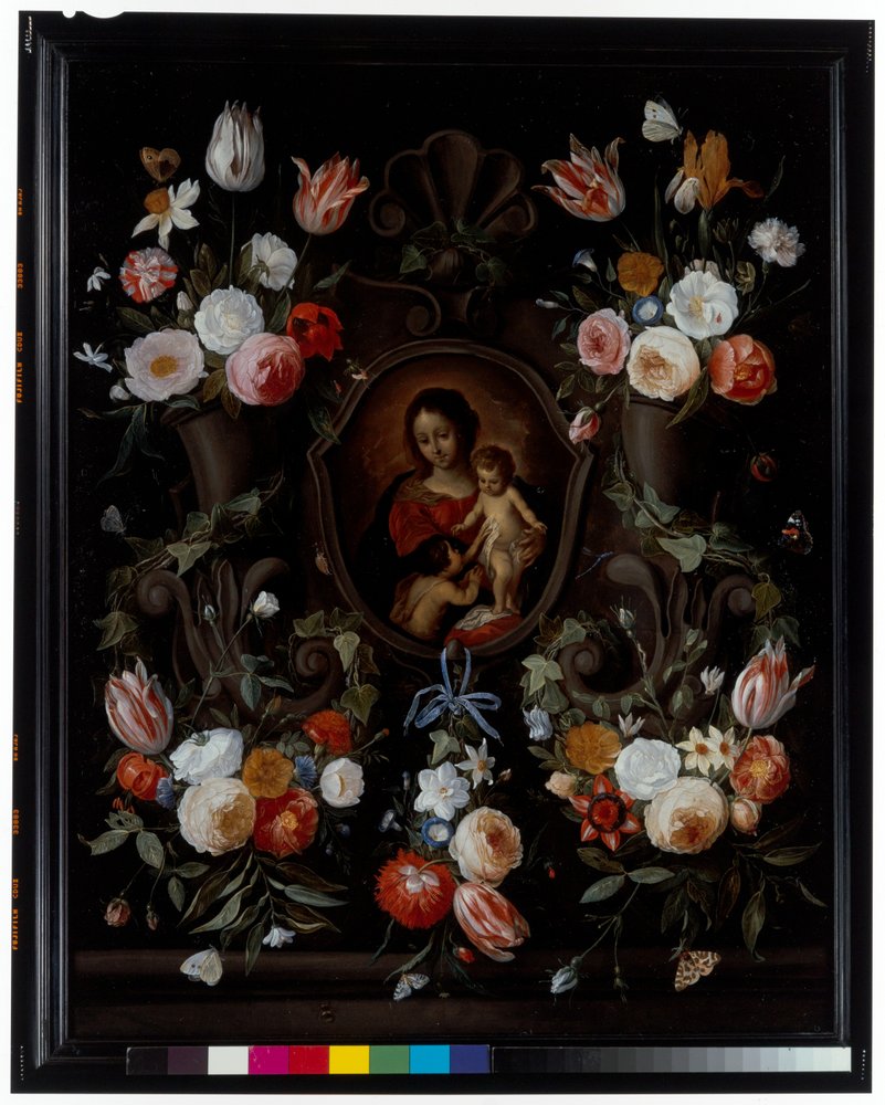 A Stone Cartouche Adorned With Flowers and Butterflies