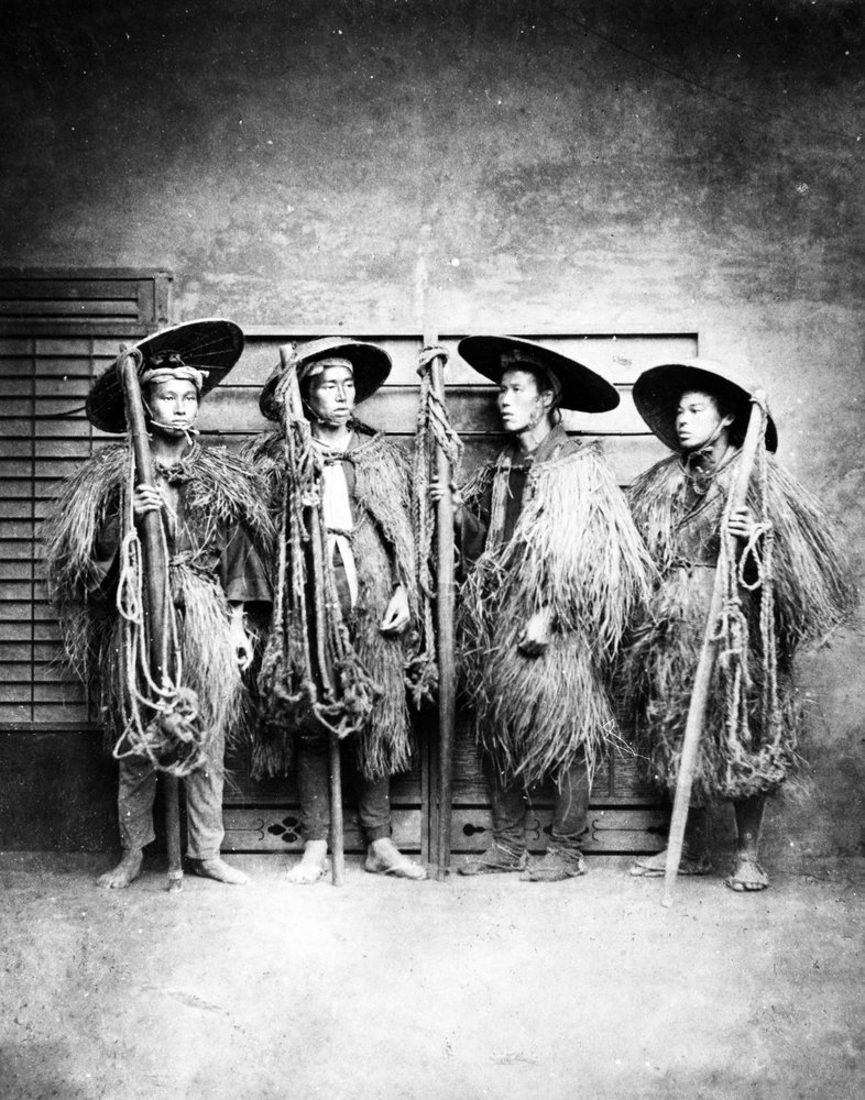 Japanese Men in Straw Coats by Japanese Photographer