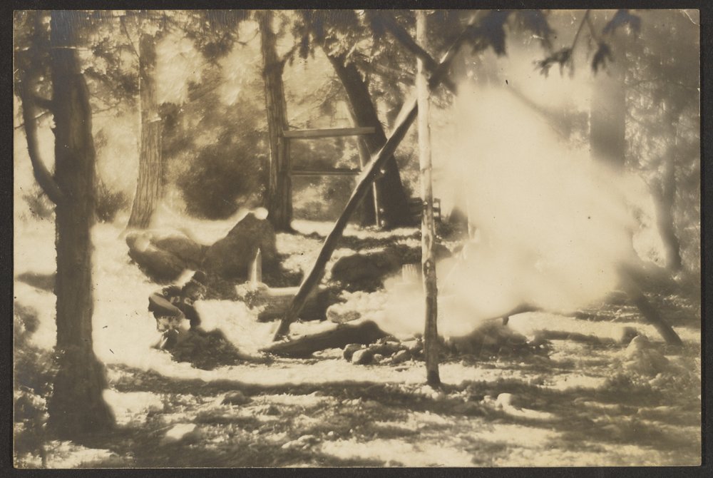 Native American and Teepee Structure in Woods