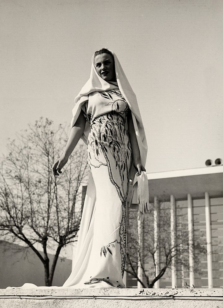 Model in an evening dress of floral print fabric, created by the ...