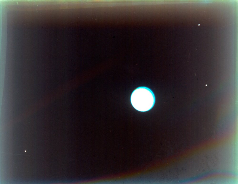 Uranus with satellites Miranda, Ariel and Umbriel, from Voyager 2, 24 ...