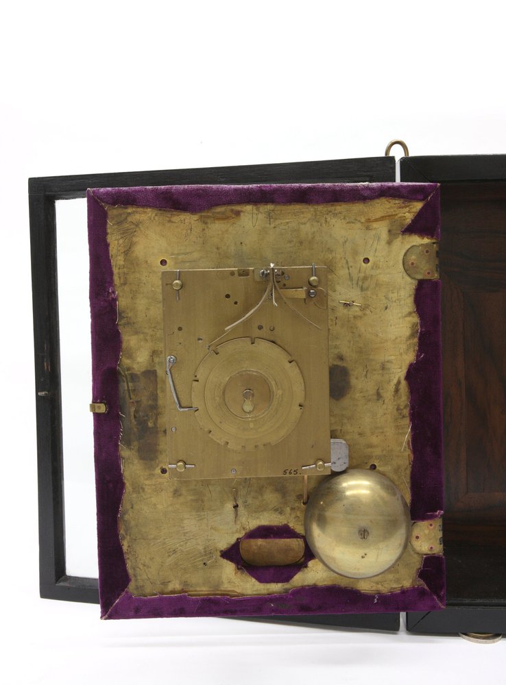 The back of the dial and movement of a table clock