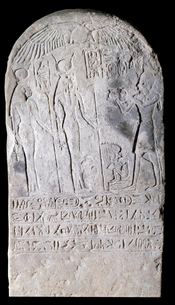 Stele of limestone representing a scene of offerings covered with ...