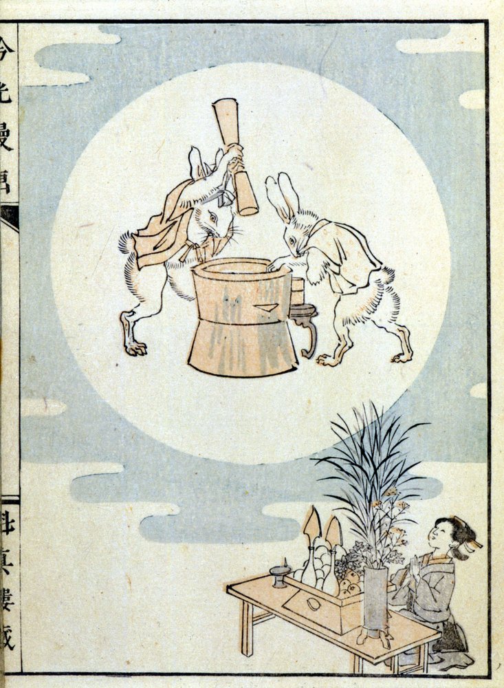 Japanese in prayer and rabbits in the moon pounding rice powder