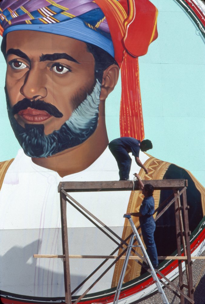 Workmen Maintain a Giant Mural of Qaboos bin Said Al Said, Sultan of Oman