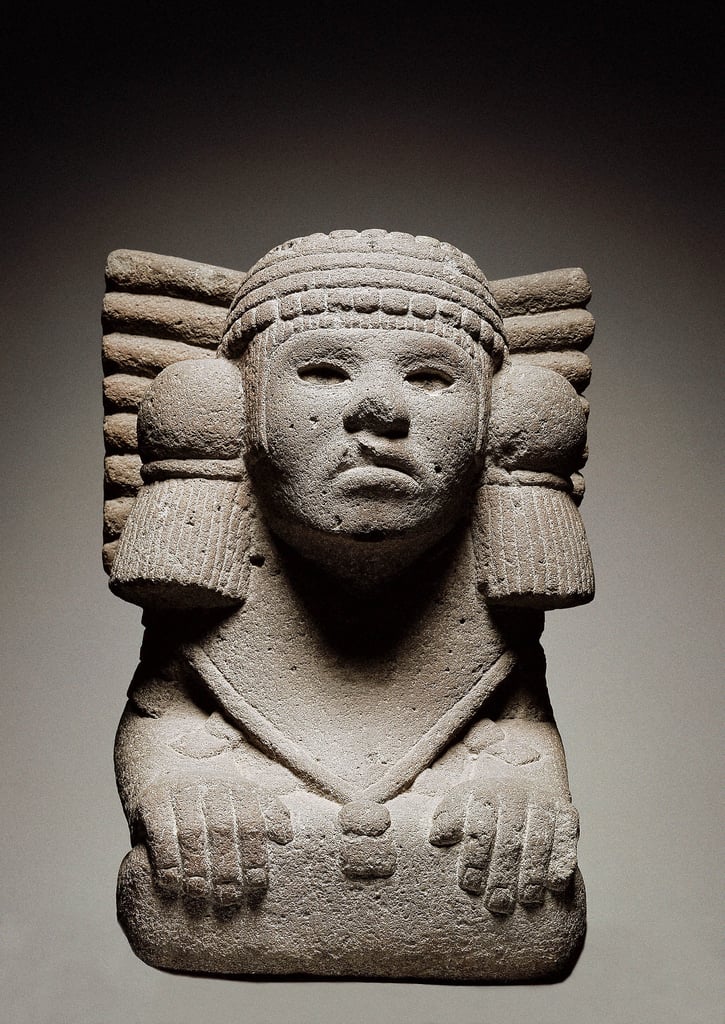 Aztec civilization: Stone statue representing the deity of the Aztec ...