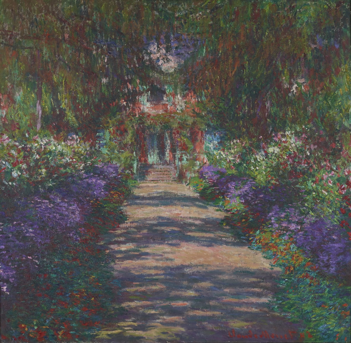 An avenue in Monet's garden in Giverny by Claude Monet