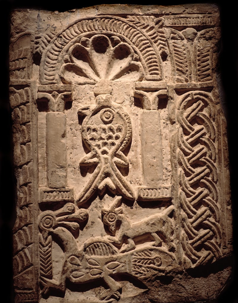 Coptic civilization: wall fragment of high reliefs with fish (Christian ...