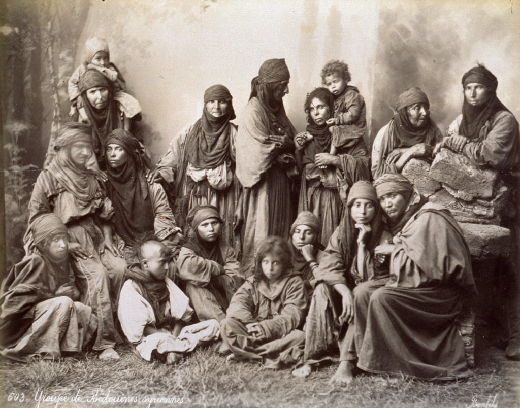 Portrait of a group of syrian bedouins in humble ethnic dress