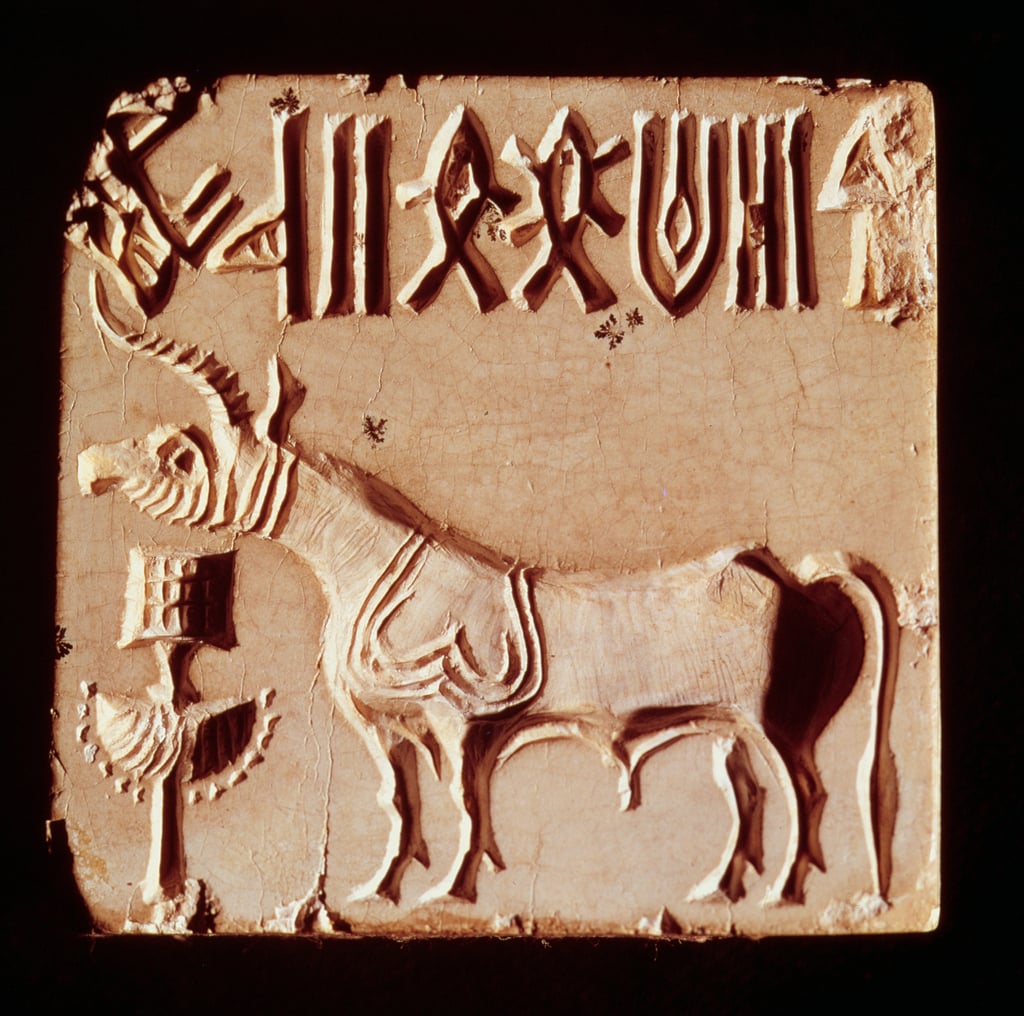 Seal depicting a mythological animal and pictographic symbols, from ...