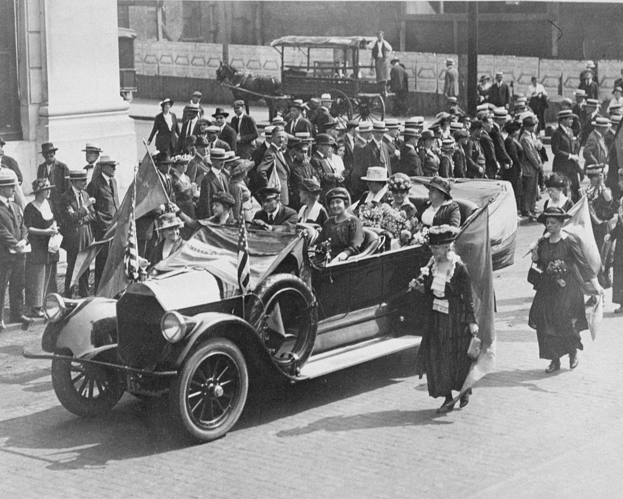 Carrie Chapman Catt, Upton and Shuler Being Driven in a Suffrage Parade