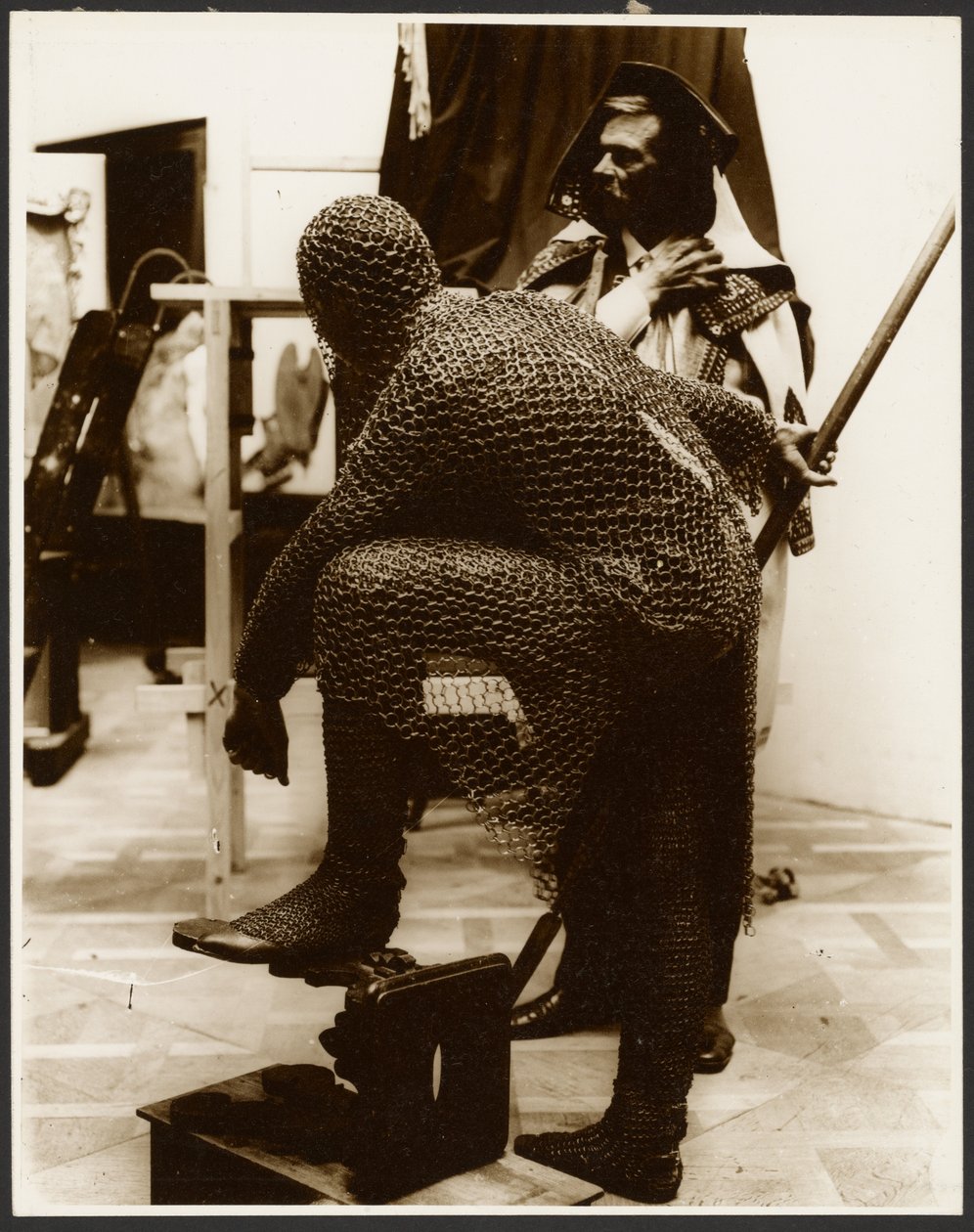Two Male Models as Ancient Warriors, One Wearing Chain Mail Armor