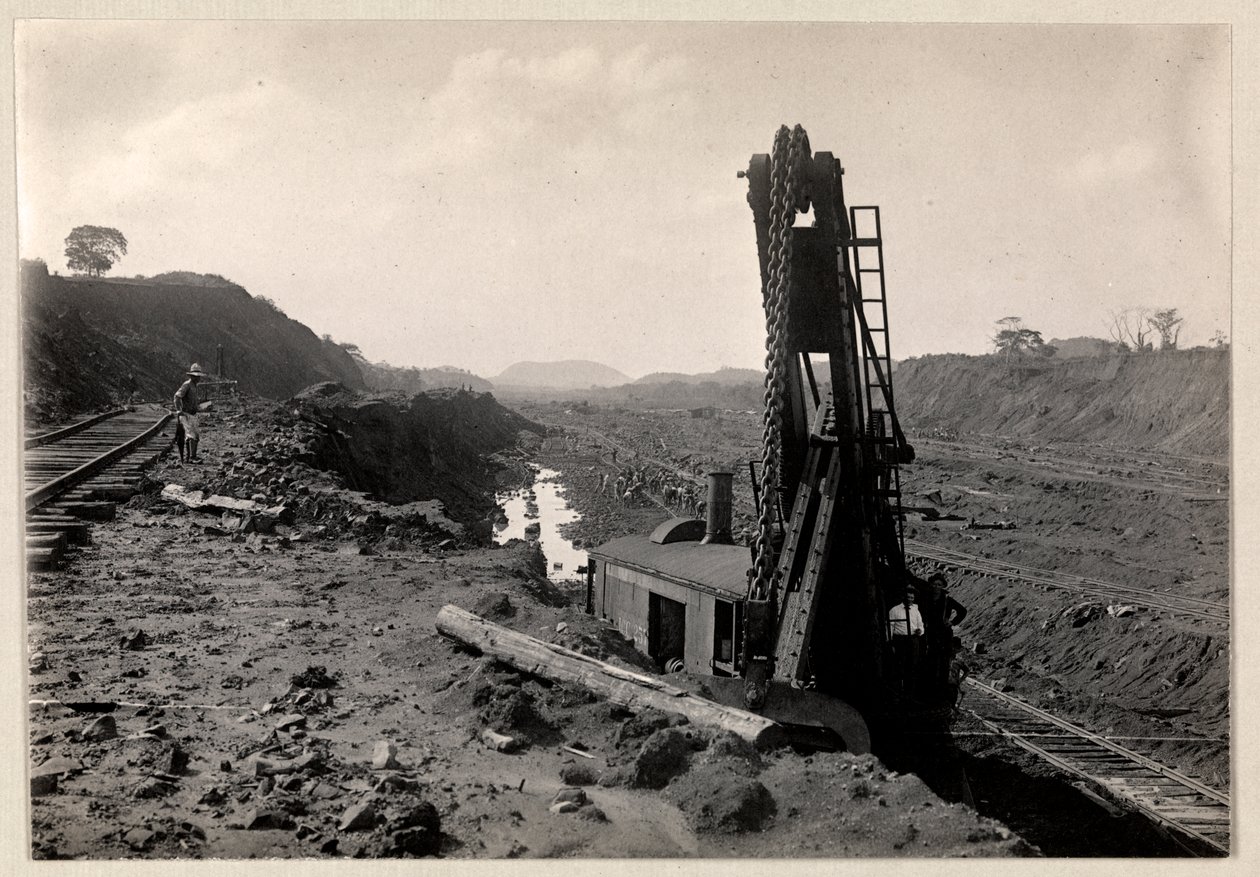 View of laborers digging the Panama Canal with railroad tracks and ...