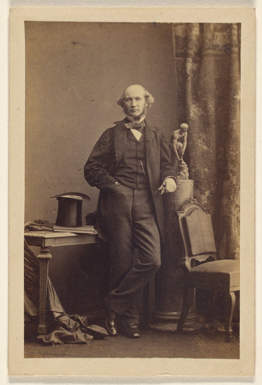 Unidentified man standing, top hat on table by Camille Silvy