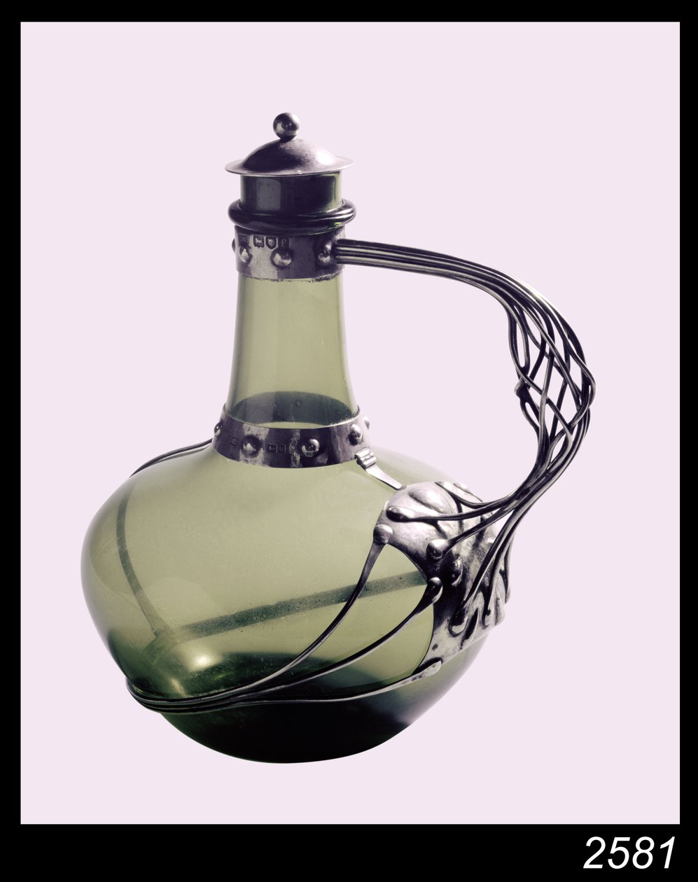 Silver-mounted green glass decanter with makers mark for the Guild of ...