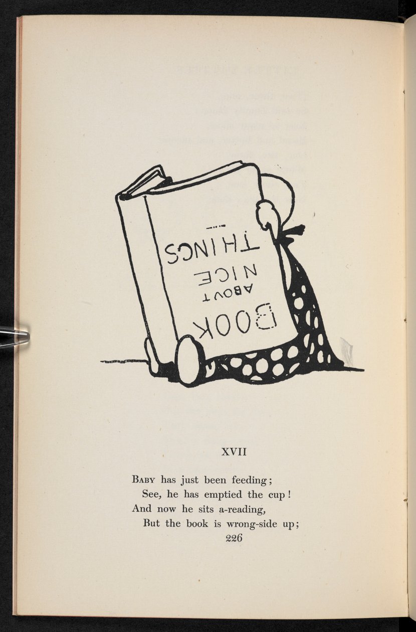 A rhyme. A child reading a book upside down