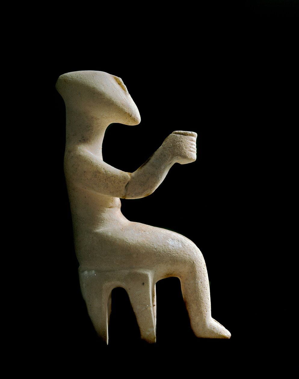 Art of the Cyclades Figurine Sitting on a Stool Marble Idol Inlaid with Ochre. Cycladic Civilization 3200 2000 BC National Archaeological Museum