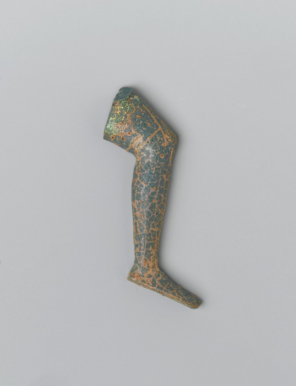 Small blue green opaque glass human leg from an inlay figure