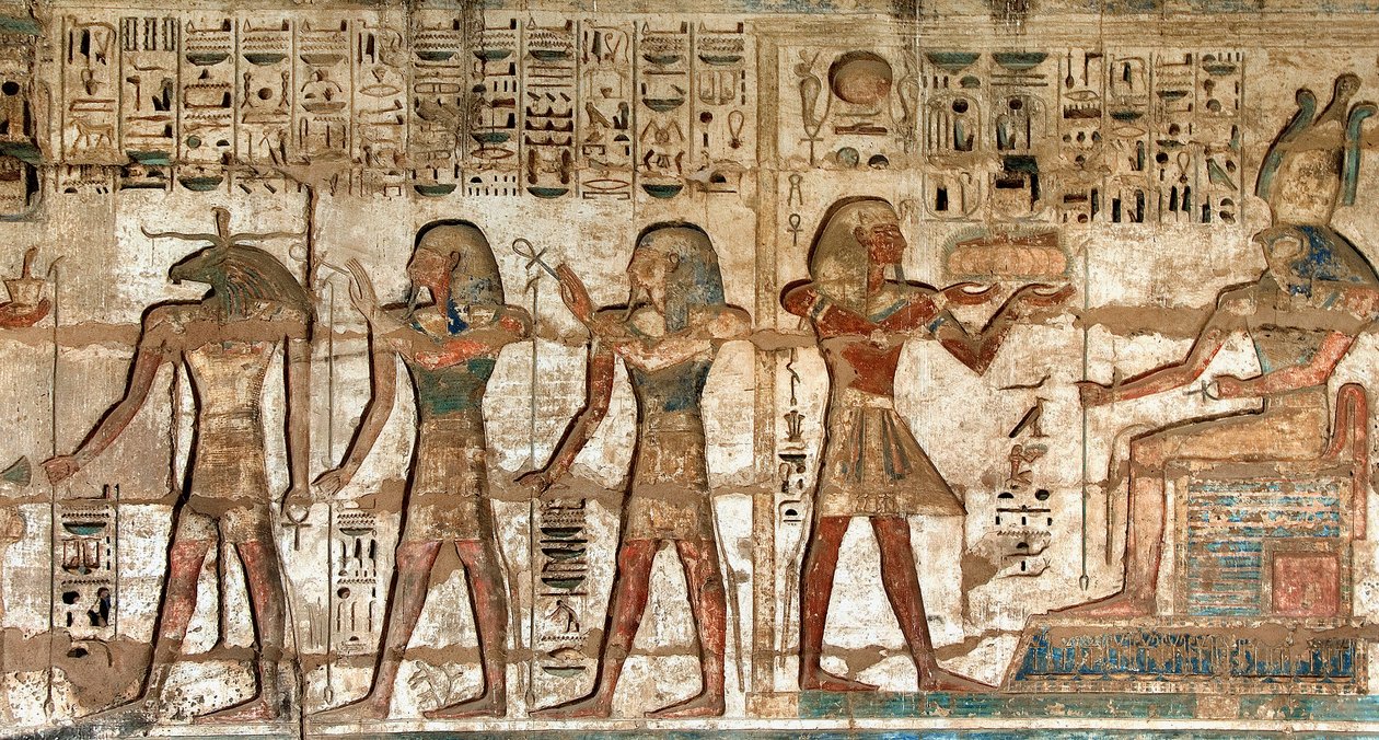 First court, detail of painted reliefs depicting the pharaoh carrying ...