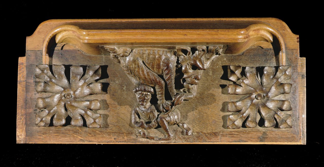 A misericord depicting a small capped figure pounced on by a monster ...