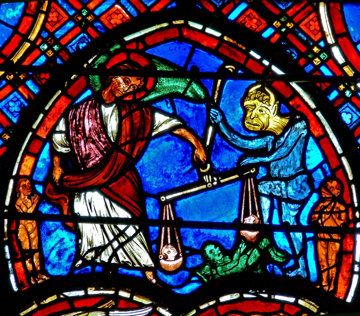 Window depicting a scene from the Last Judgement: St Michael weighing ...