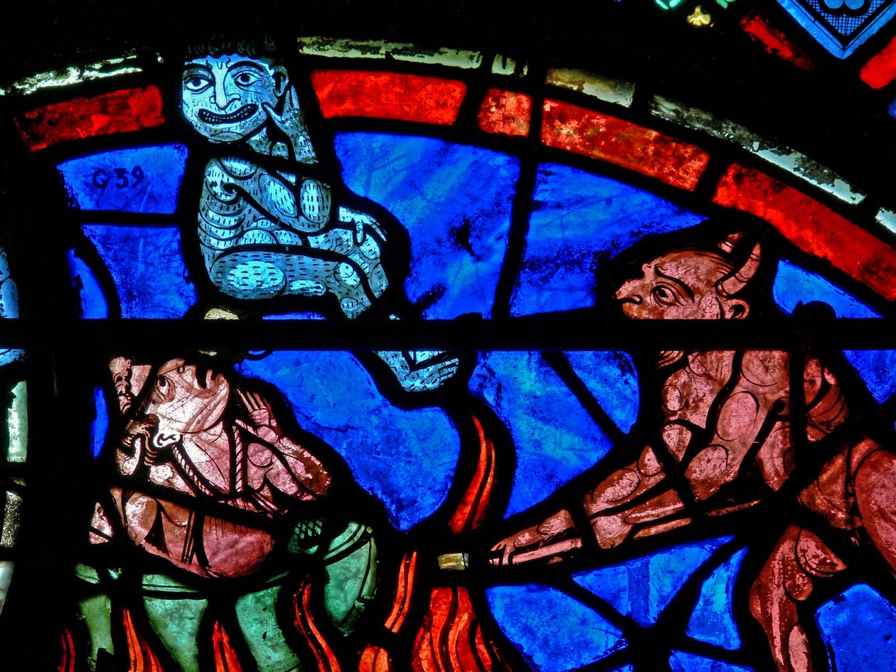 Window depicting an impenitent being tormented by demons