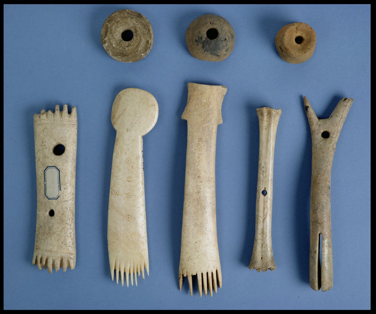 Spindle whorls, antler weaving combs and a bone shuttle and loom ...