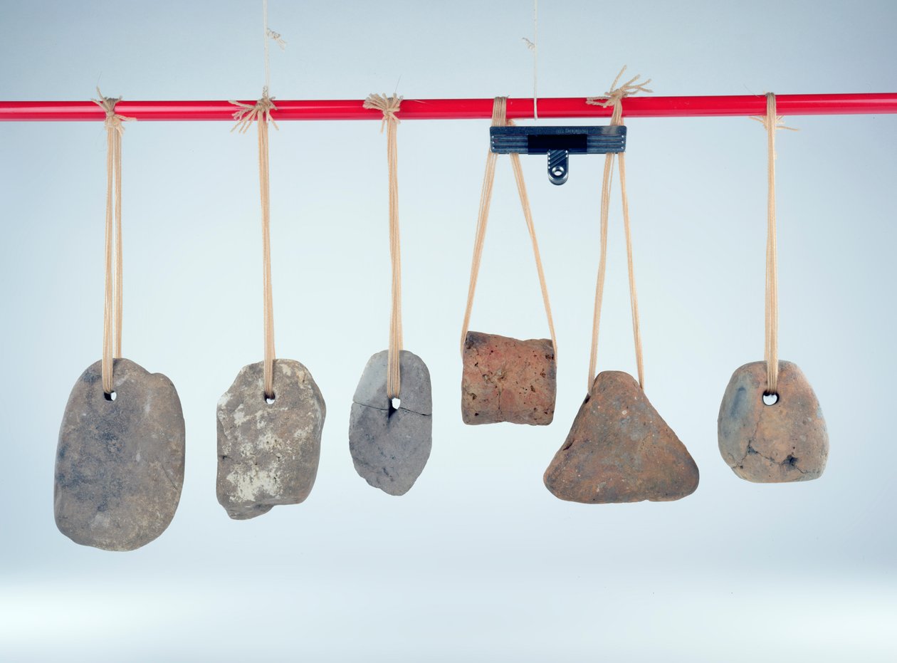 Weights used to keep vertical warp threads taut on upright looms, Iron Age