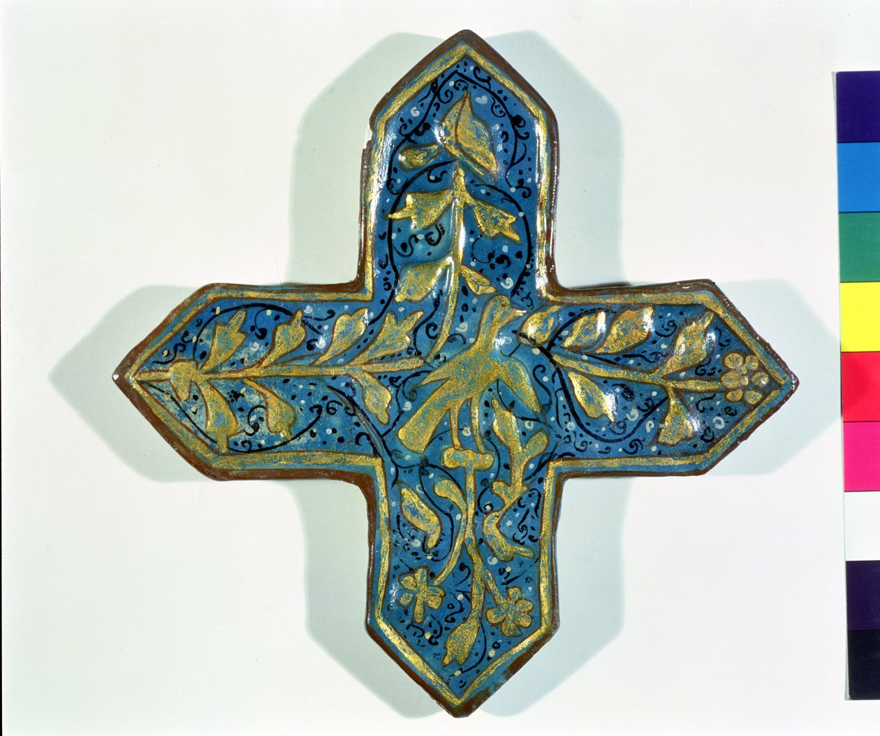 Cruciform overglaze leaf-gilded tile in the style of Takht-e Solaiman