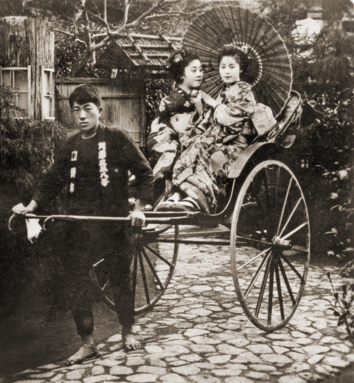 Runner Pulling Two Geishas on a Rickshaw in Japan