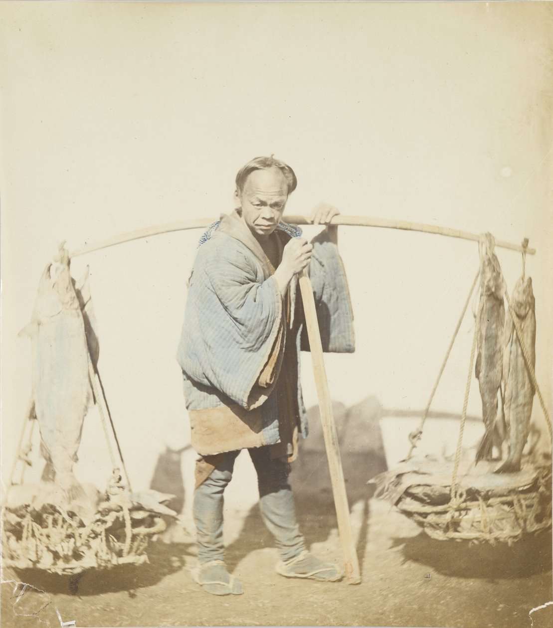 Fisherman with his catch by Japanese Photographer