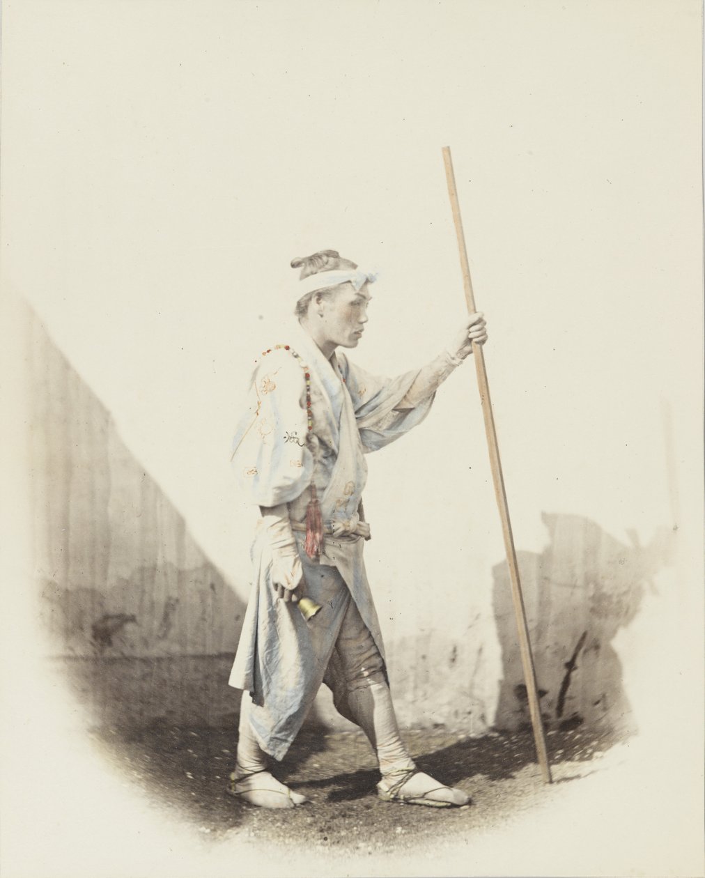 Japanese man with bell by Japanese Photographer