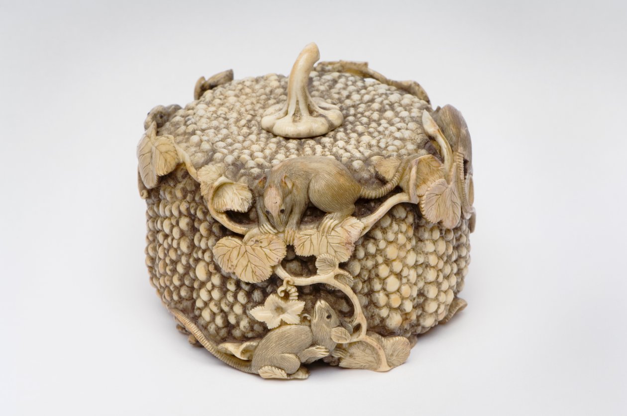 Okimono carved as four playful rats jumping over a pumpkin