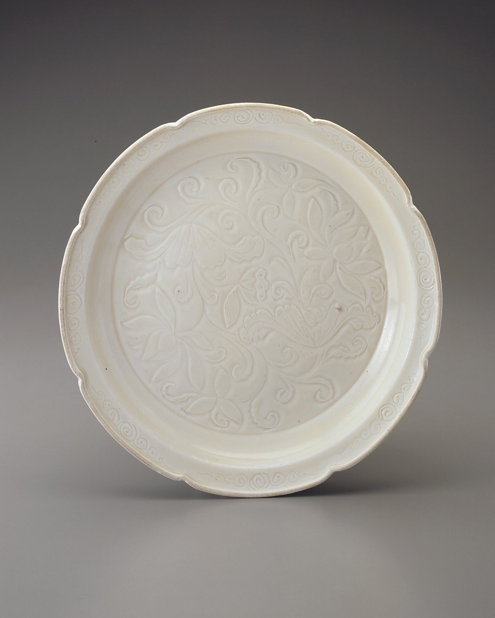 Dish with foliate rim and carved decoration