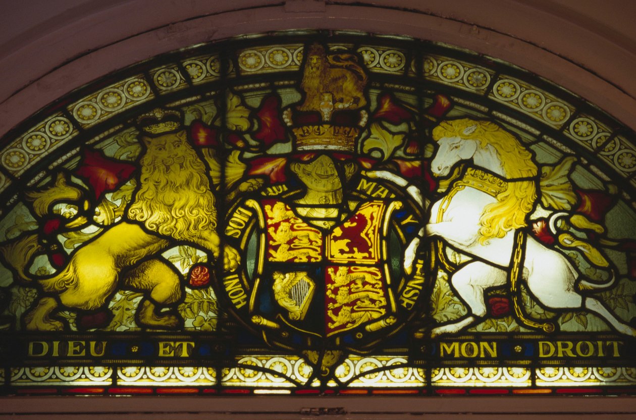 Stained glass window with the royal coat of arms of the United Kingdom ...